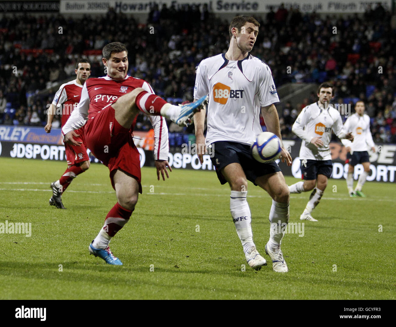 York City's Peter Till has a shot on goal as Bolton Wanderers' Gary ...