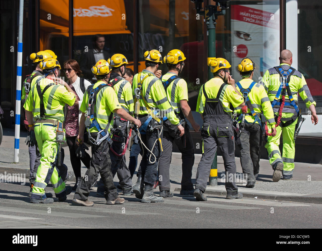 STOCKHOLM SWEDEN 4 May 2016. A group of workers wearing helmets and ...
