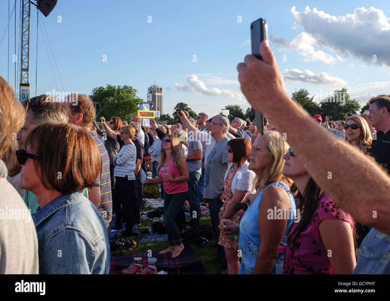 People using mobile phones at an outdoor music concert UK Stock Photo ...