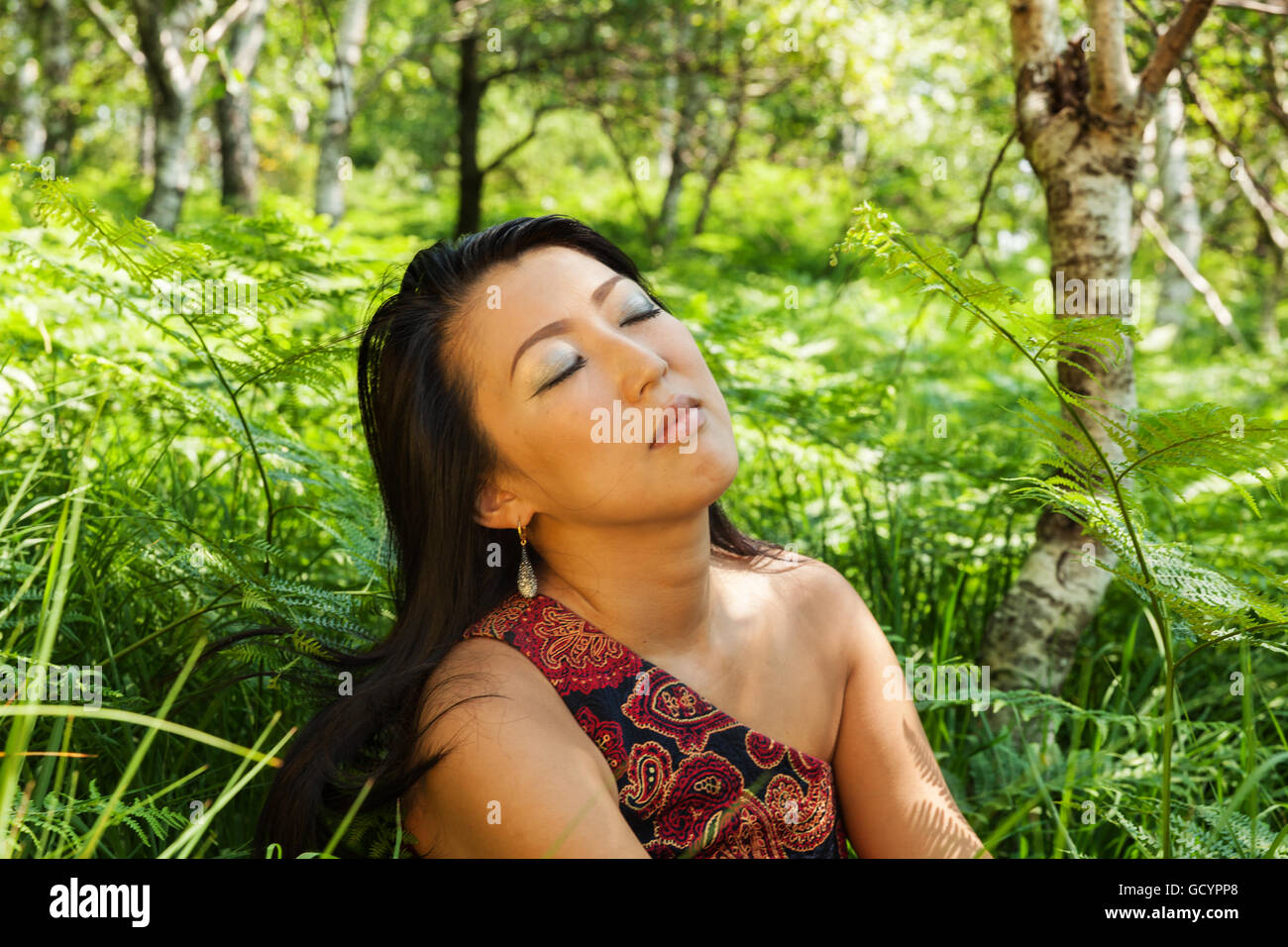 Asian girl portrait outdoors in the woods Stock Photo - Alamy