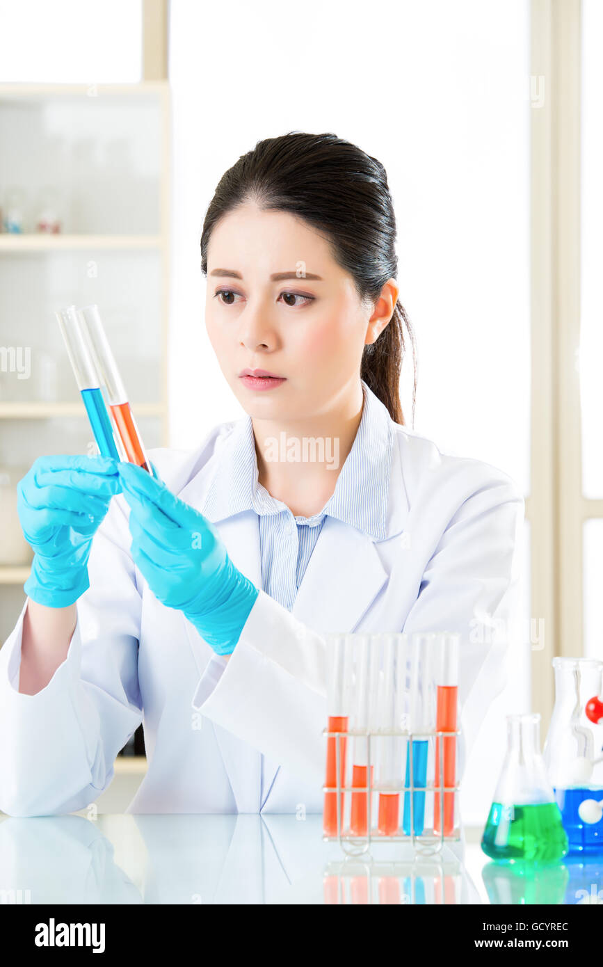 Asian female chemist working on chemical substances in laboratory Stock ...