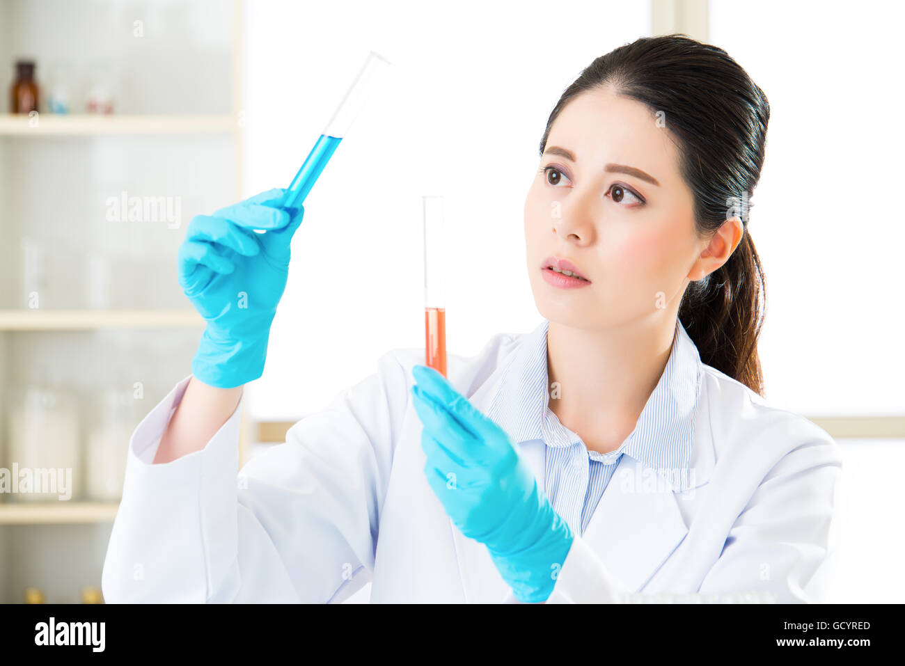 Asian female scientist breaking scientific boundaries with her research ...