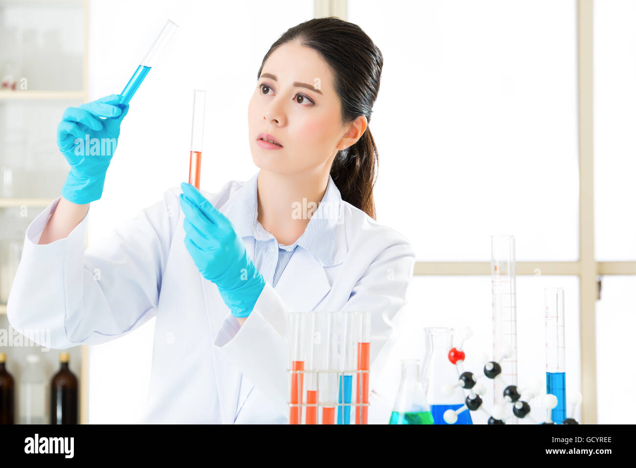 Asian female forensic scientist Research and development in laboratory ...