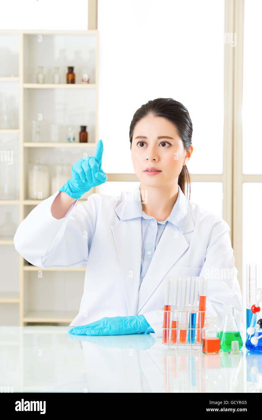 asian science fascinated by the results on touch screen in laboratory ...