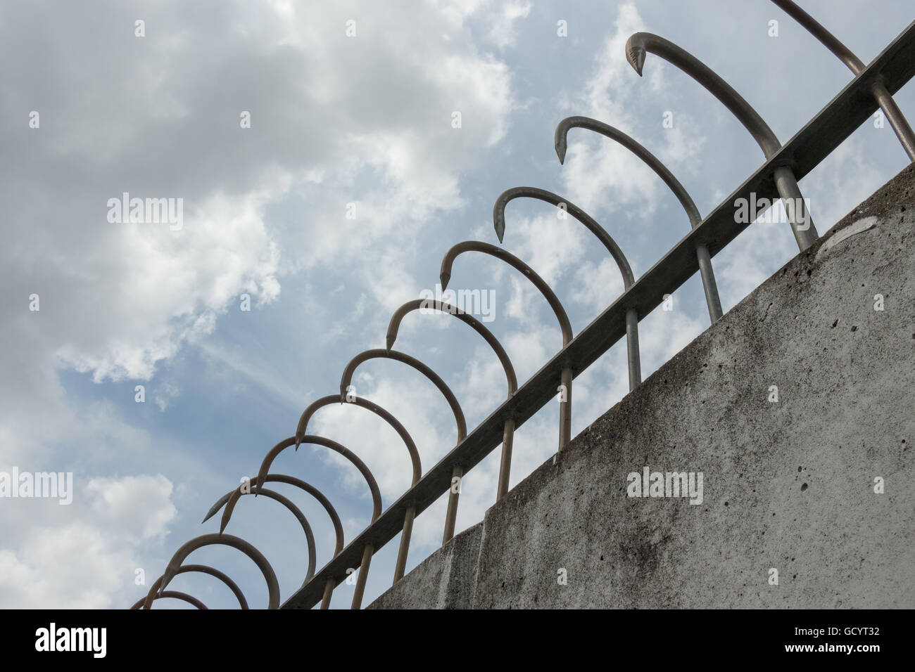 Strong steel spiked security deterrent difficult to climb over at top ...