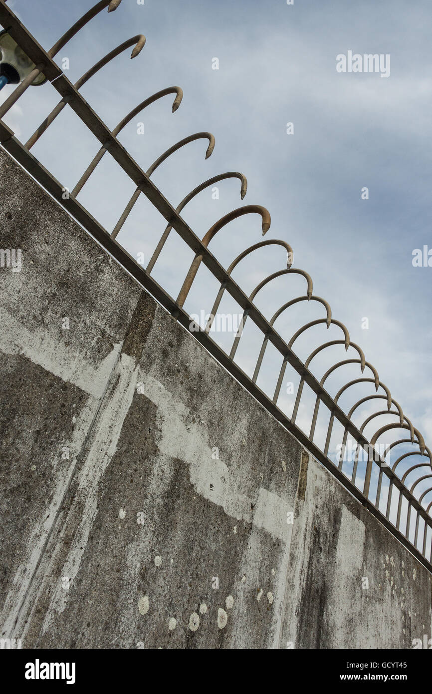 Strong steel spiked security deterrent difficult to climb over at top ...