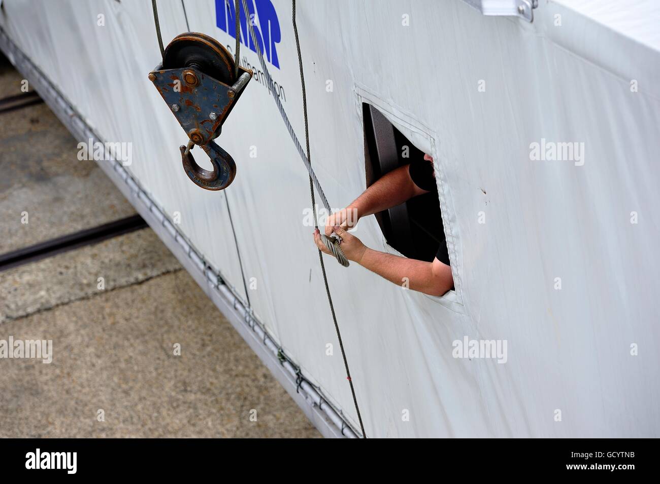 Hands waiting to affix the rope Stock Photo - Alamy