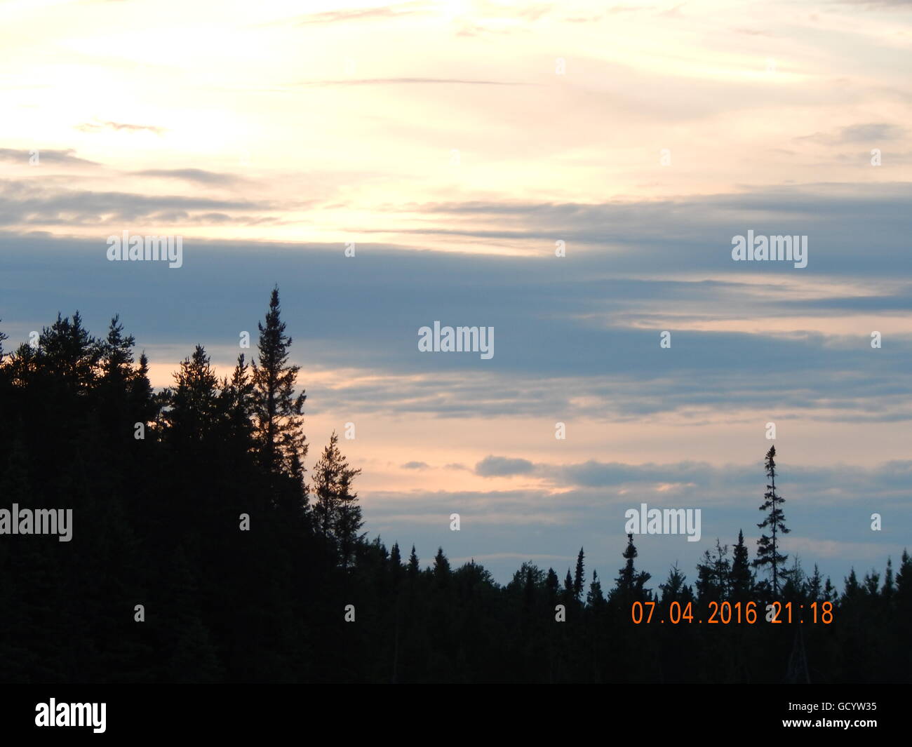 Sun setting over forest hi-res stock photography and images - Alamy