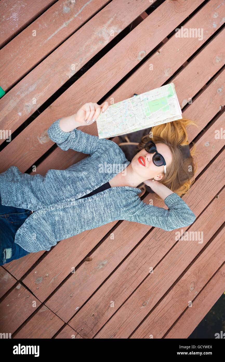 Young woman with map Stock Photo - Alamy