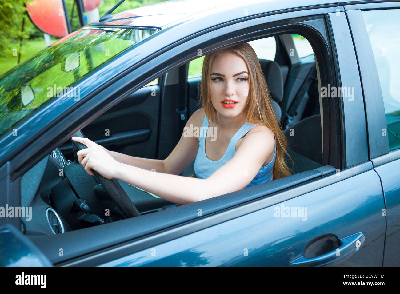 One young girl riding a car Stock Photo - Alamy