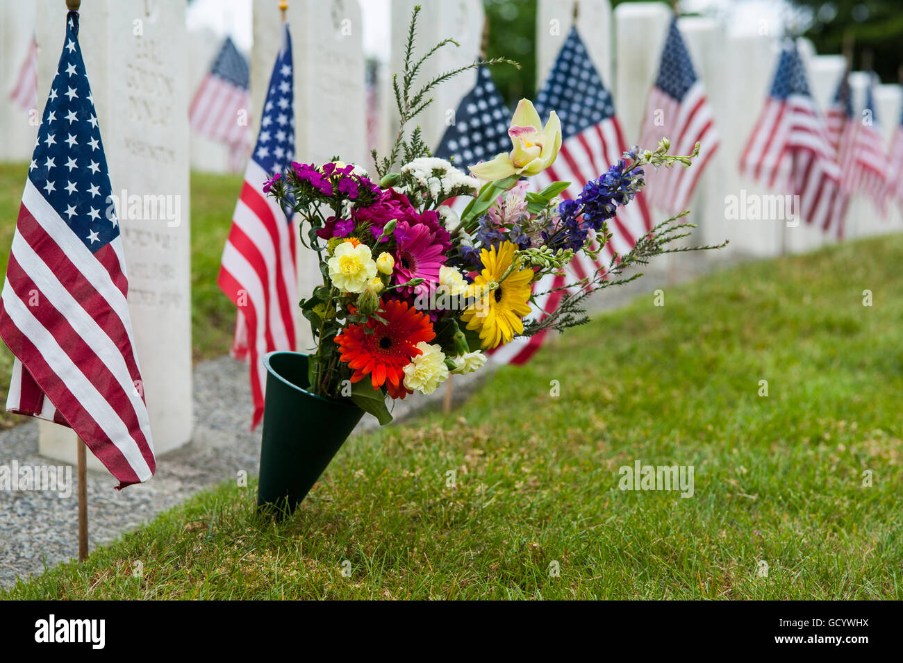Memorial Day Ceremony at cemetery with American Flags at grave sites ...