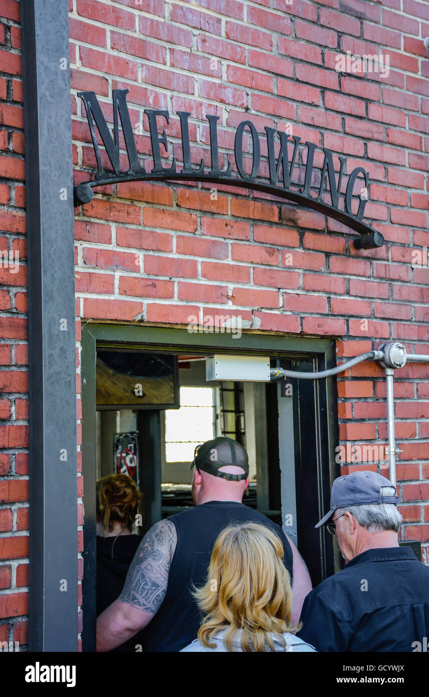 Tourists following along as they enter the brick Mellowing house at the ...