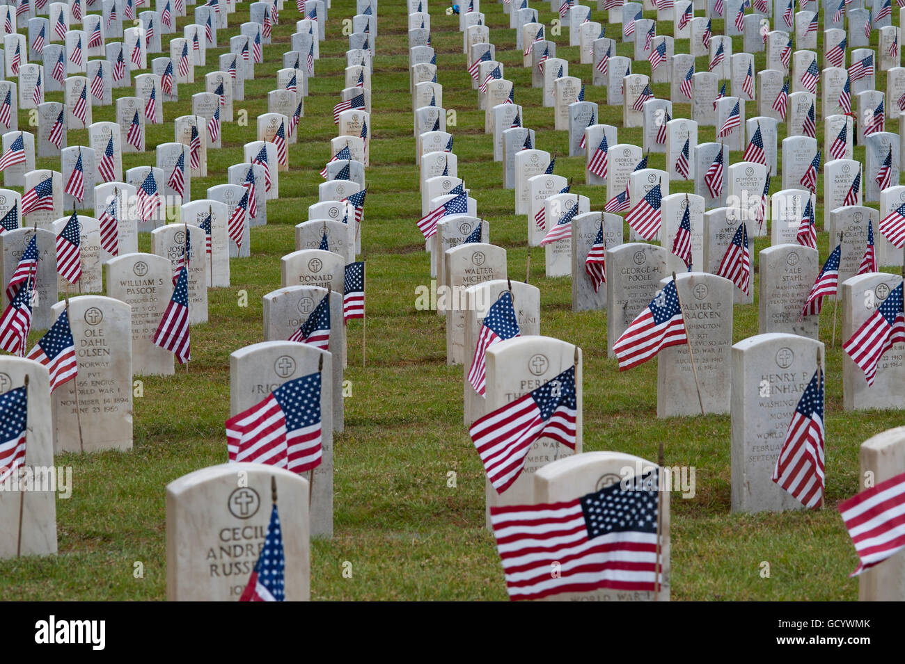 Memorial Day Ceremony at cemetery with American Flags at grave sites ...