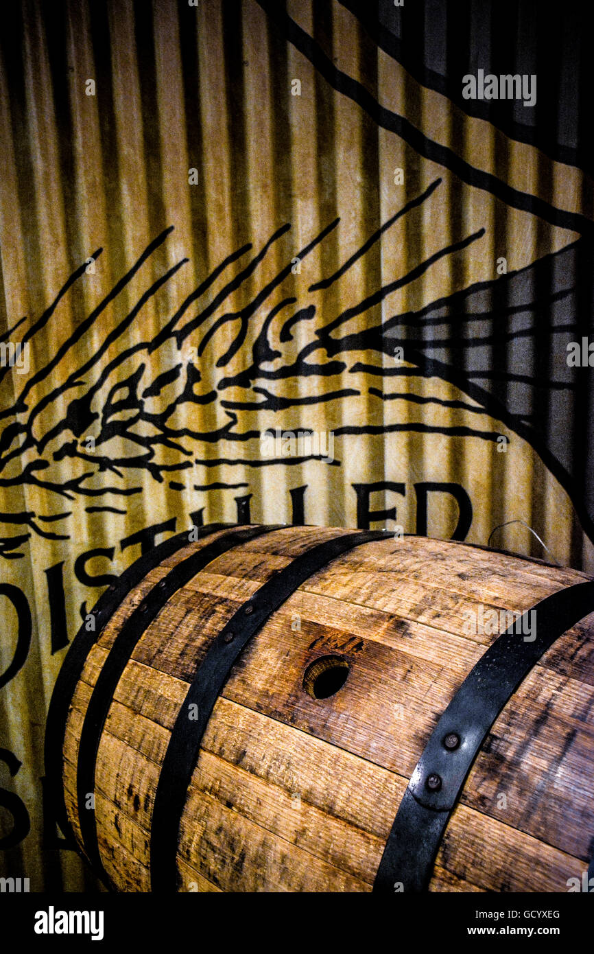 An authentic aged white oak barrel with metal bands with bung hole ...