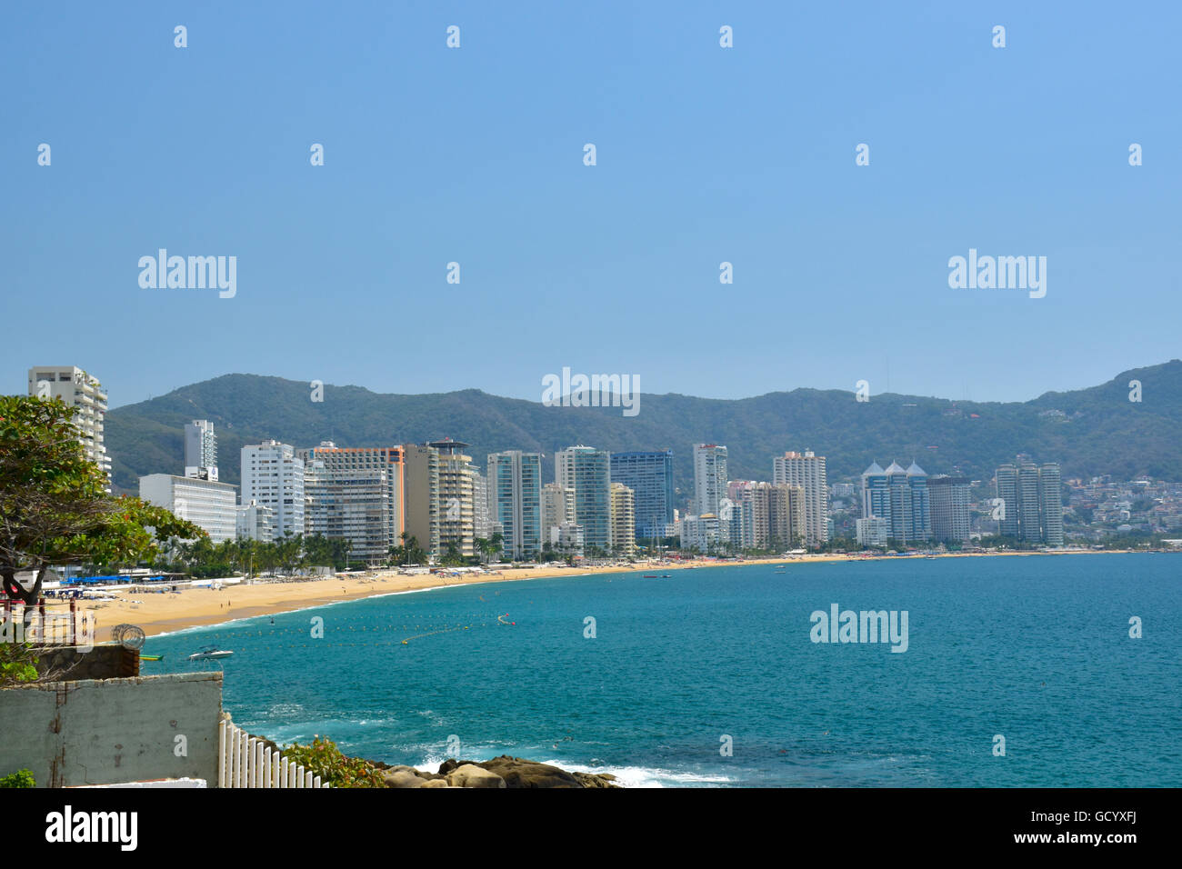 Pacific Ocean in Acapulco Bay and skyline of Acapulco, Mexico Stock ...