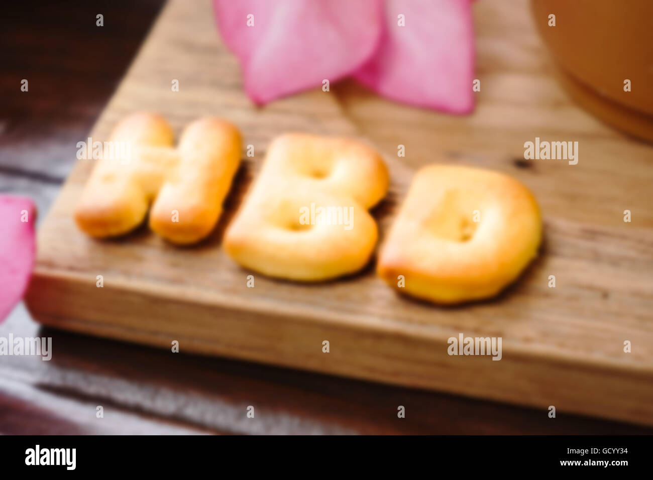 iced coffee and biscuit alphabet spell HBD with rice field background ...