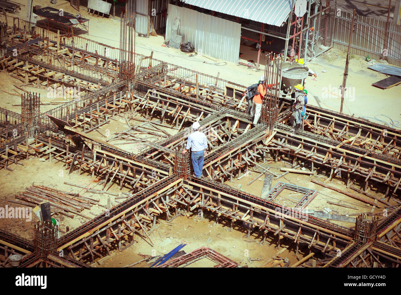 building under construction with workers Stock Photo - Alamy