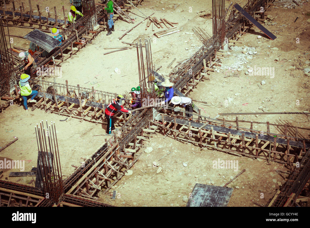 building under construction with workers Stock Photo - Alamy