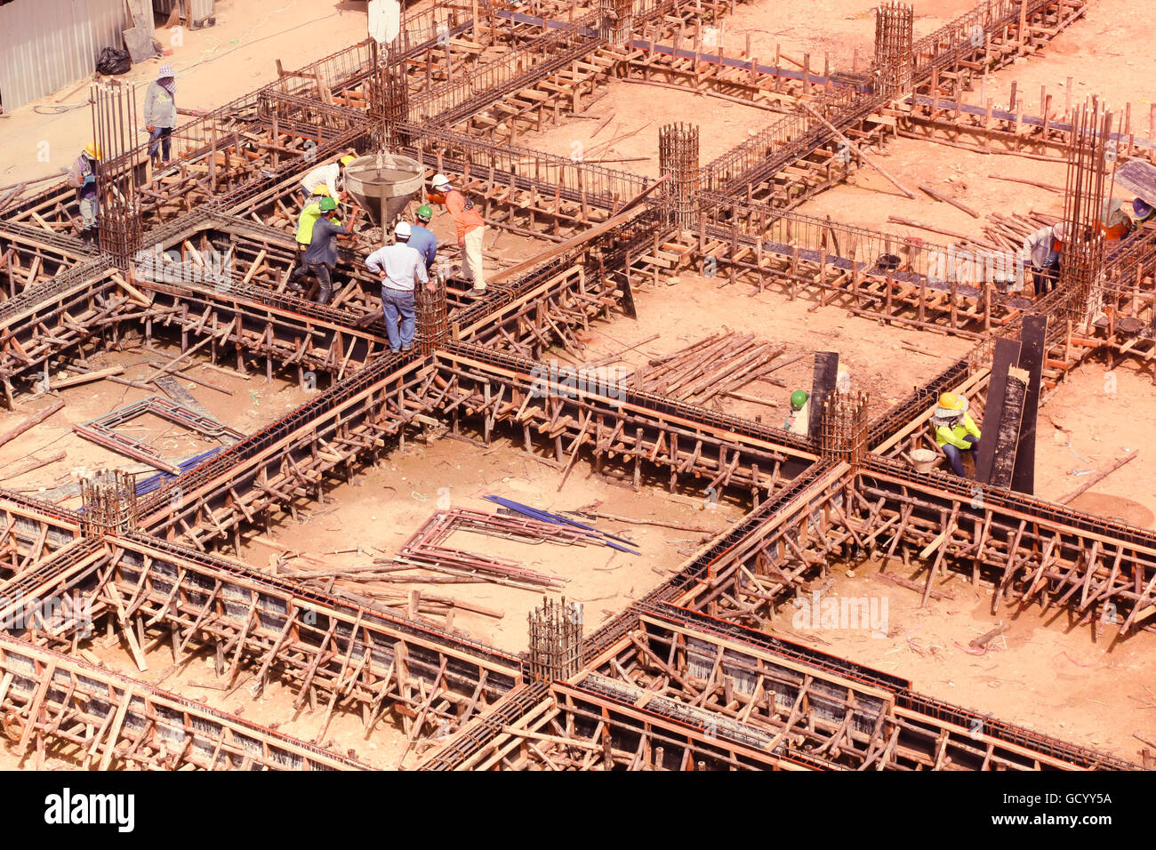 building under construction with workers Stock Photo - Alamy