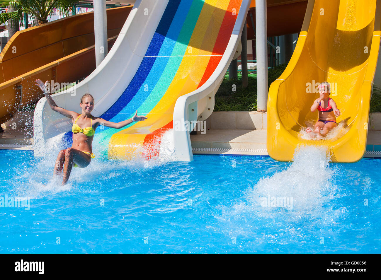 Two people water slide hi-res stock photography and images - Alamy