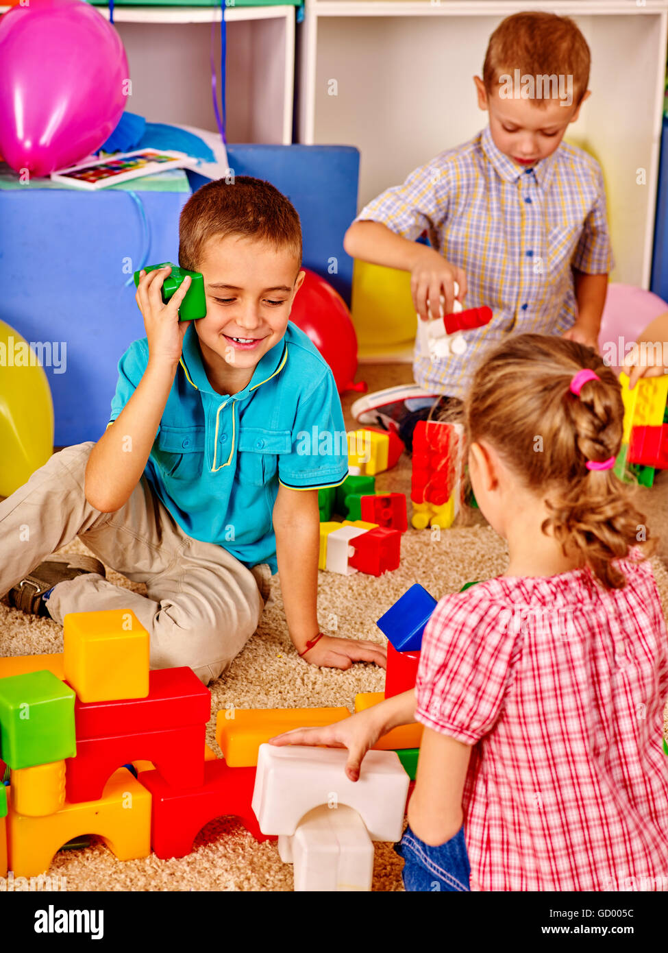 Group children game blocks on floor Stock Photo - Alamy