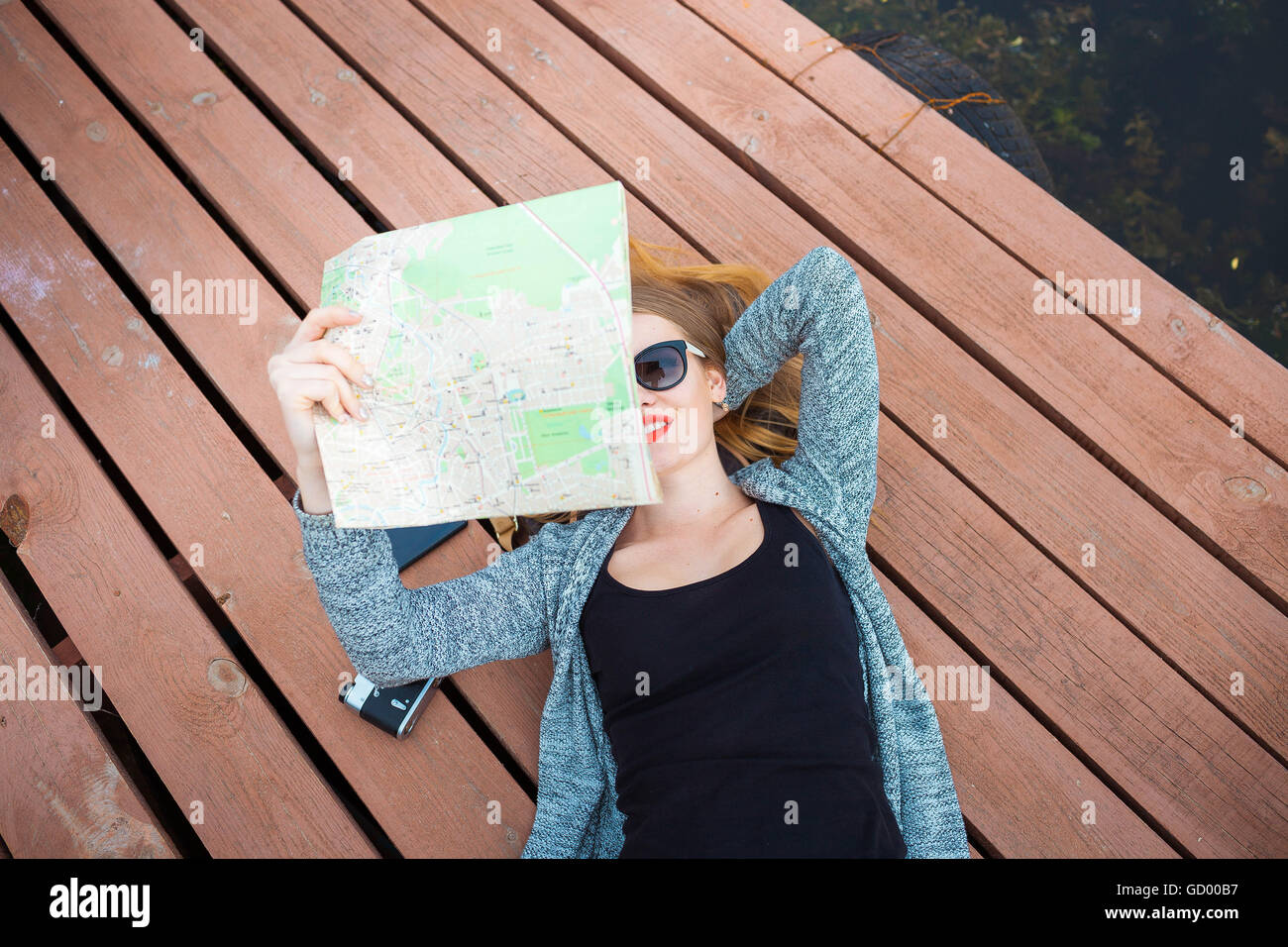 Young woman with map Stock Photo - Alamy