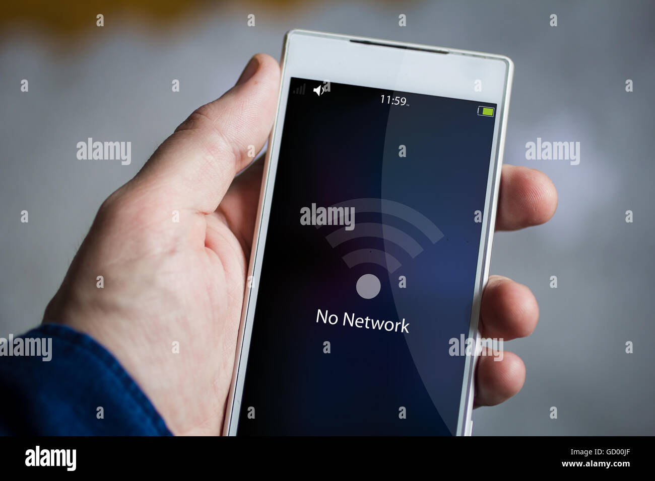 man hand holding no network smartphone. All screen graphics are made up ...