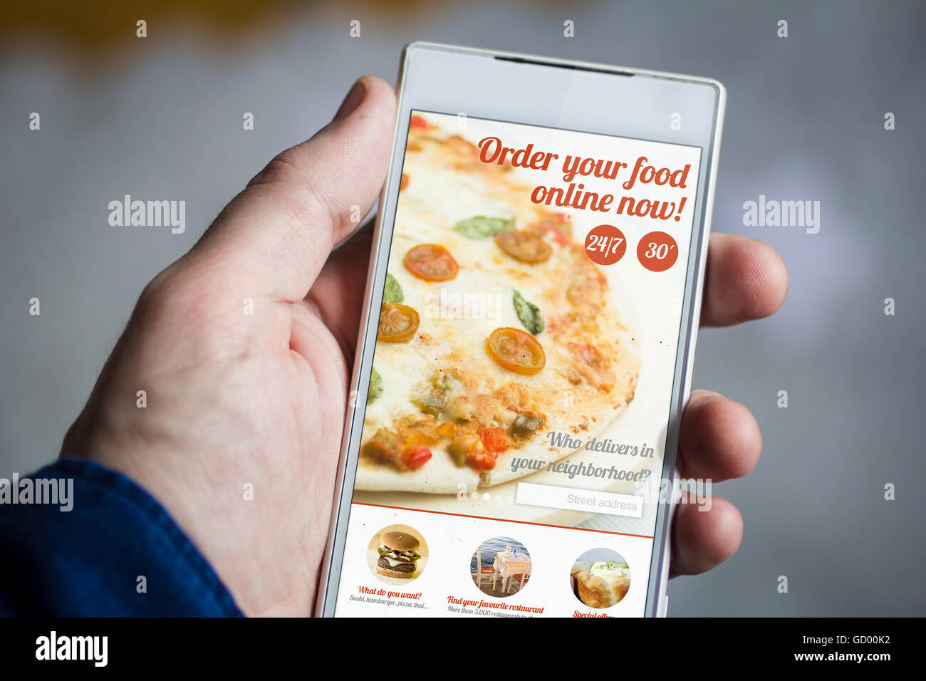 man hand holding online order food smartphone. All screen graphics are ...