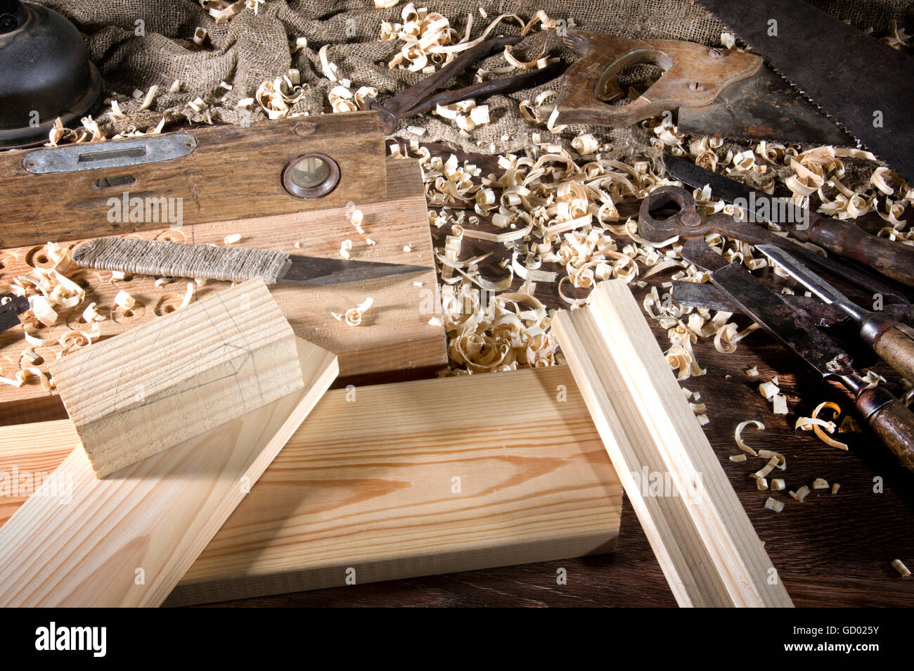 Workplace carpenter. Wood and a few tools Stock Photo - Alamy