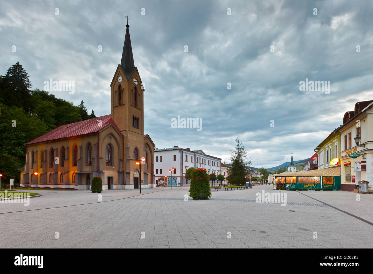 Church in the main square of Dolny Kubin late in the evening Stock ...