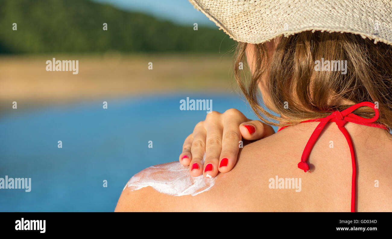 Young woman body lotion hi-res stock photography and images - Alamy