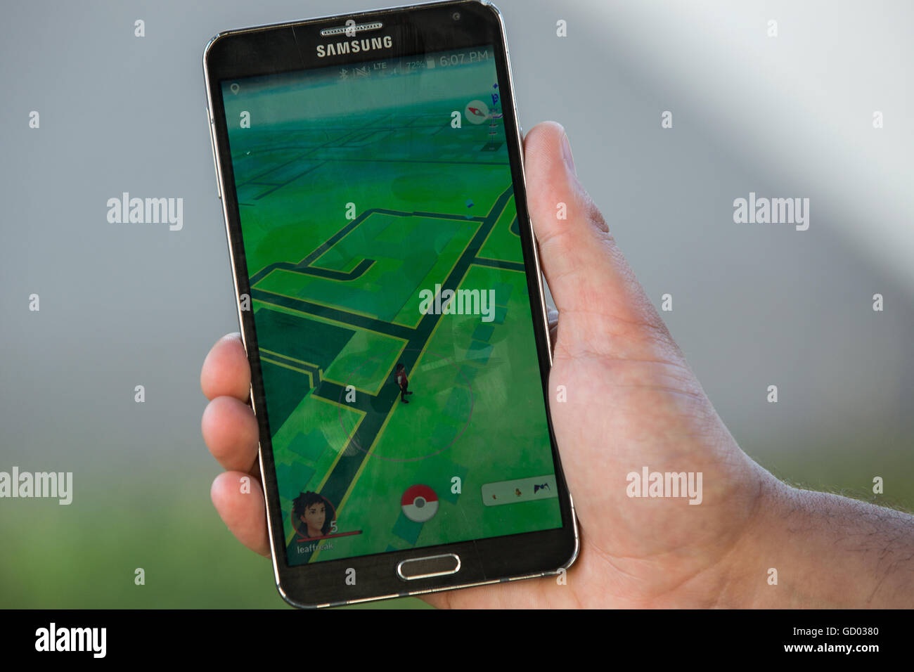 A man plays Pokemon GO on a Samsung cellphone in Kingston, Ont., on ...