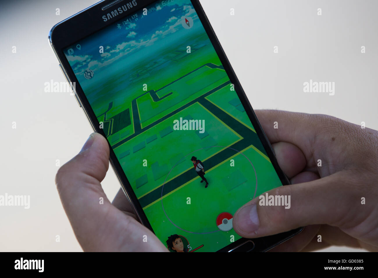 A man plays Pokemon GO on a Samsung cellphone in Kingston, Ont., on ...