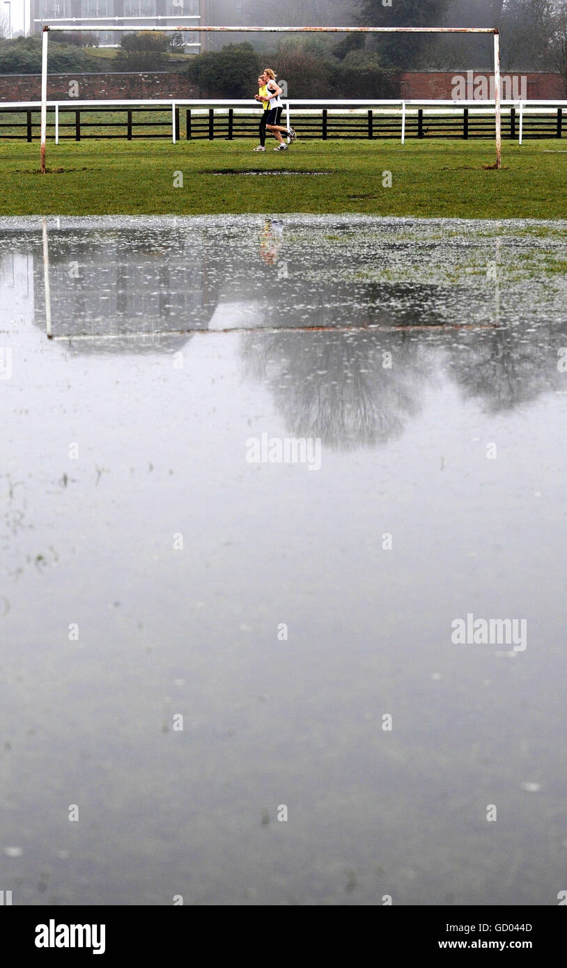 Recent snowfall which has melted leaving a football pitch under water ...