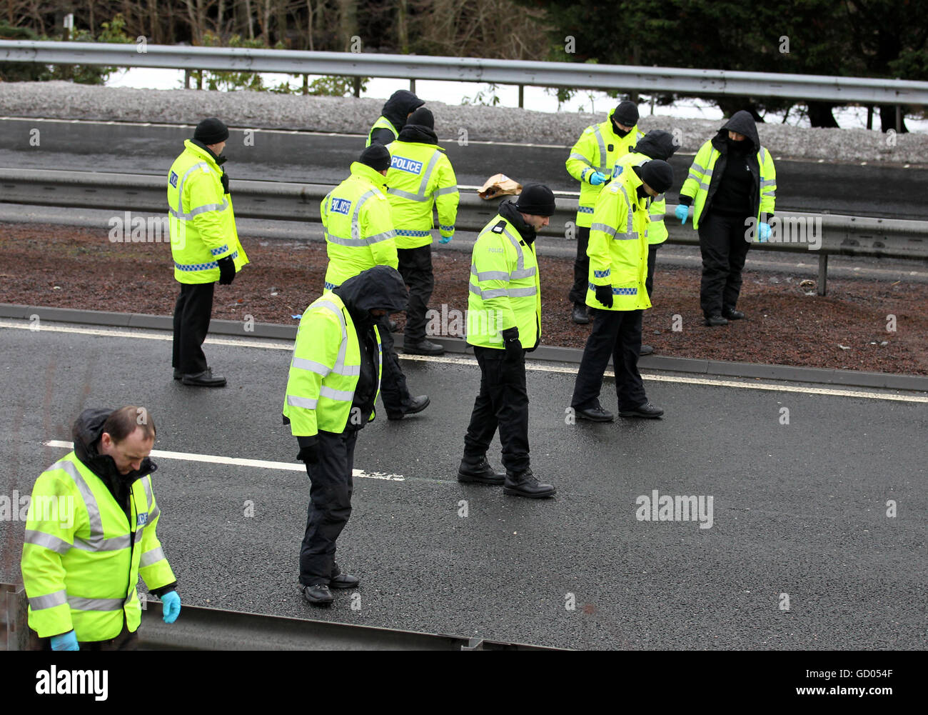 Tayside Police investigation team search the southbound carriageway of ...