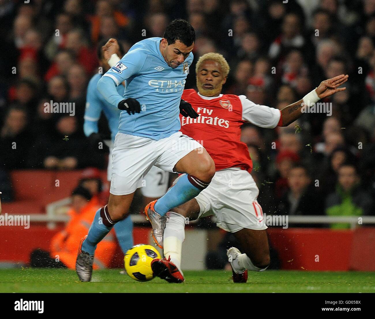Manchester City's Carlos Tevez (left) and Arsenal's Alex Song (right ...