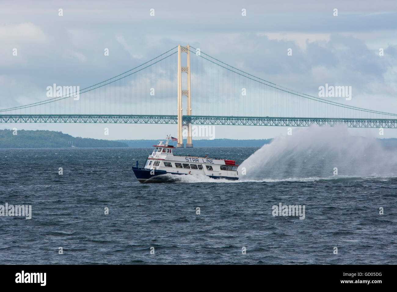 Michigan, Lake Michigan. Star Line Ferry in front of Mackinac Bridge ...