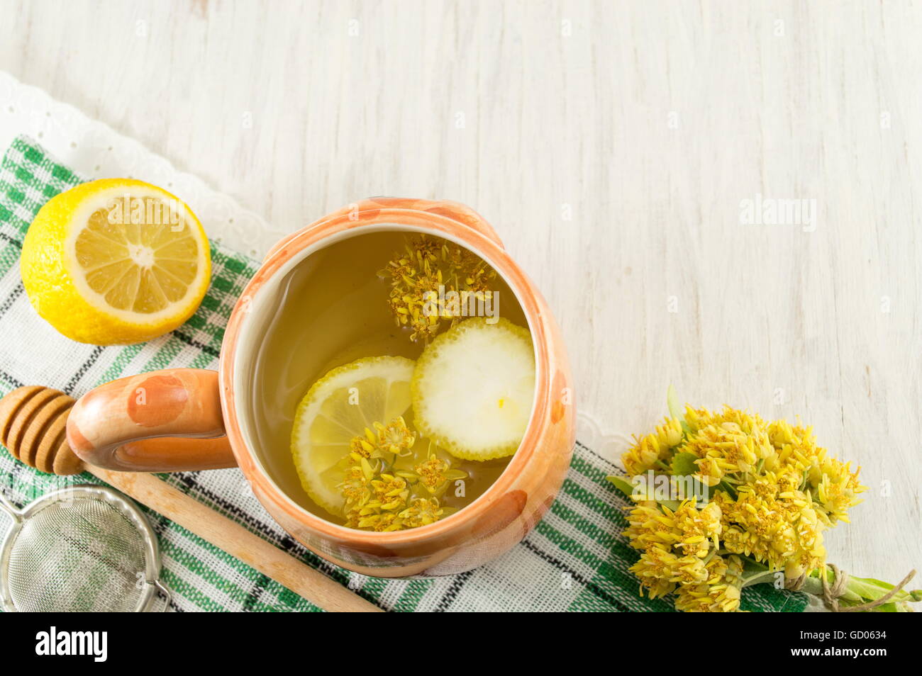 Linden Tea with fresh flowers and lemon served Stock Photo - Alamy