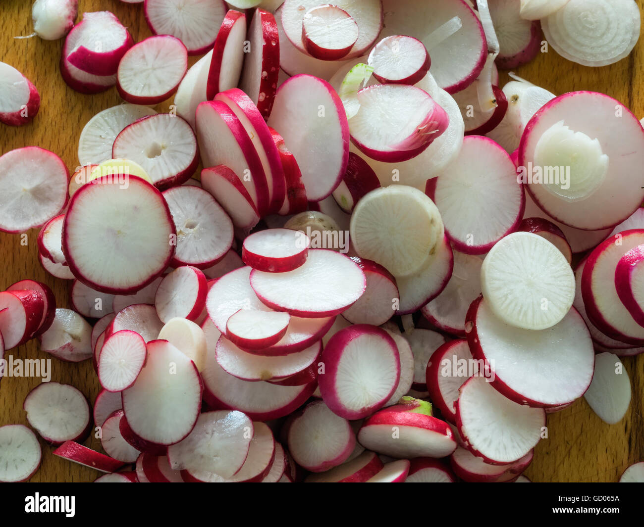 Radishes, all cut in thin slices Stock Photo - Alamy