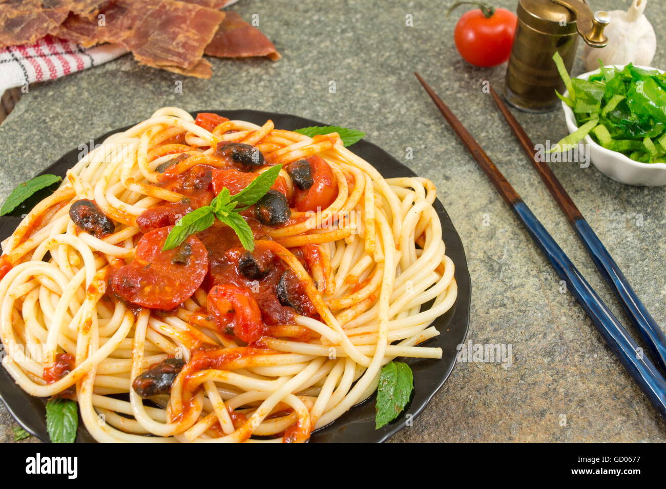 Spaghetti served with ketchup, cheese, vegetables and parsley Stock ...