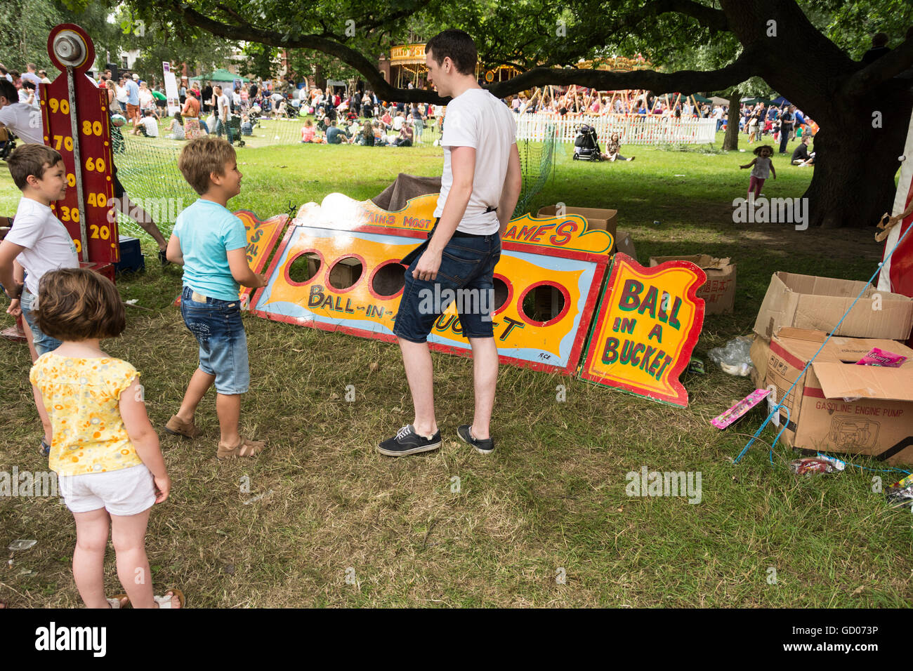 Children playing Ball in a Bucket game at the annual Barnes Village ...