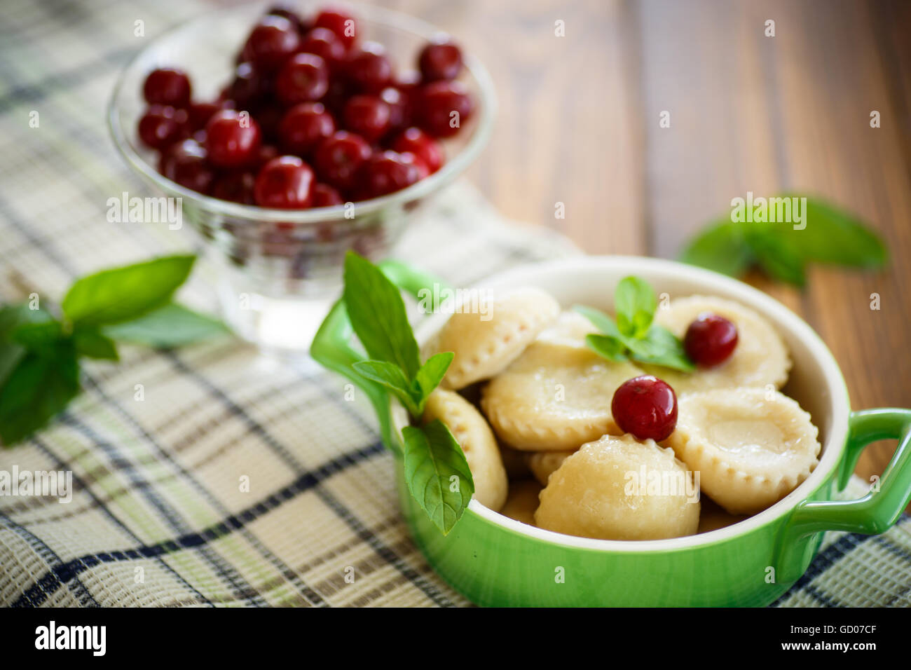 Cherry dumplings with mint Stock Photo - Alamy