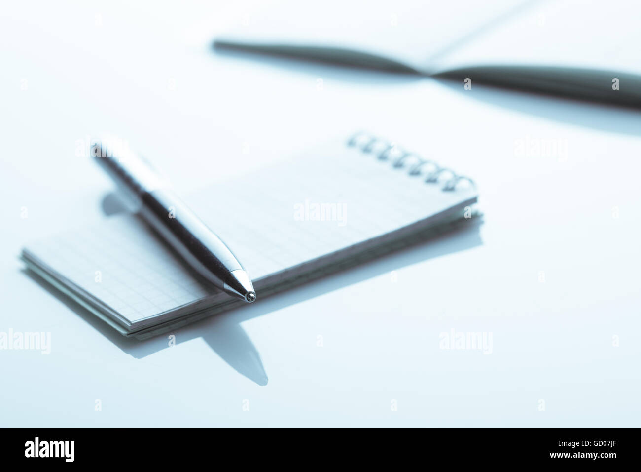 Notebook and pen on white background Stock Photo - Alamy