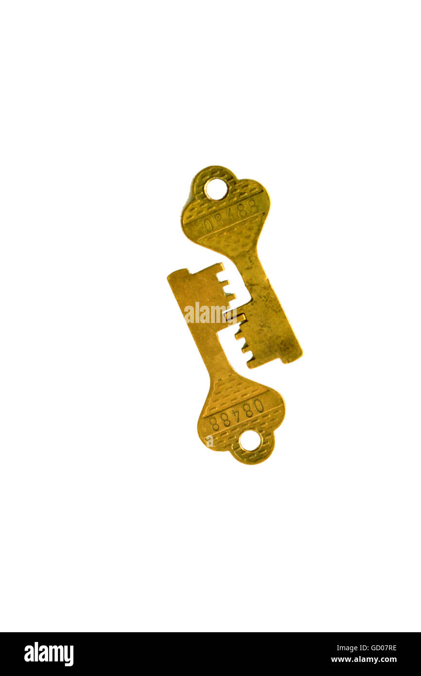 Two Golden key crossed in a white background Stock Photo - Alamy