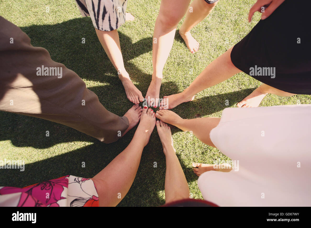 Group of young people barefoot Stock Photo - Alamy