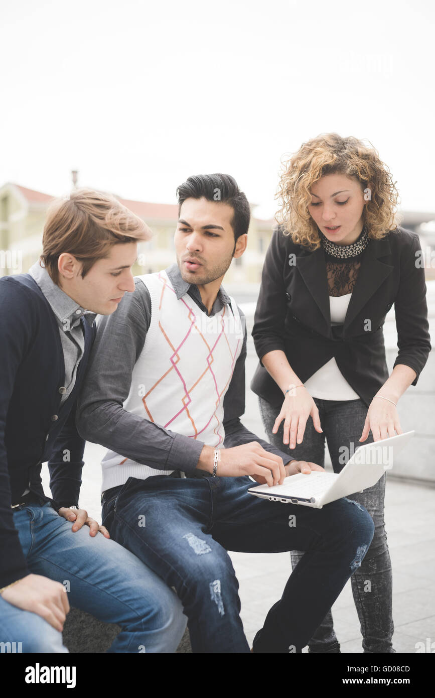 Multiracial business people working outdoor in town connected with ...