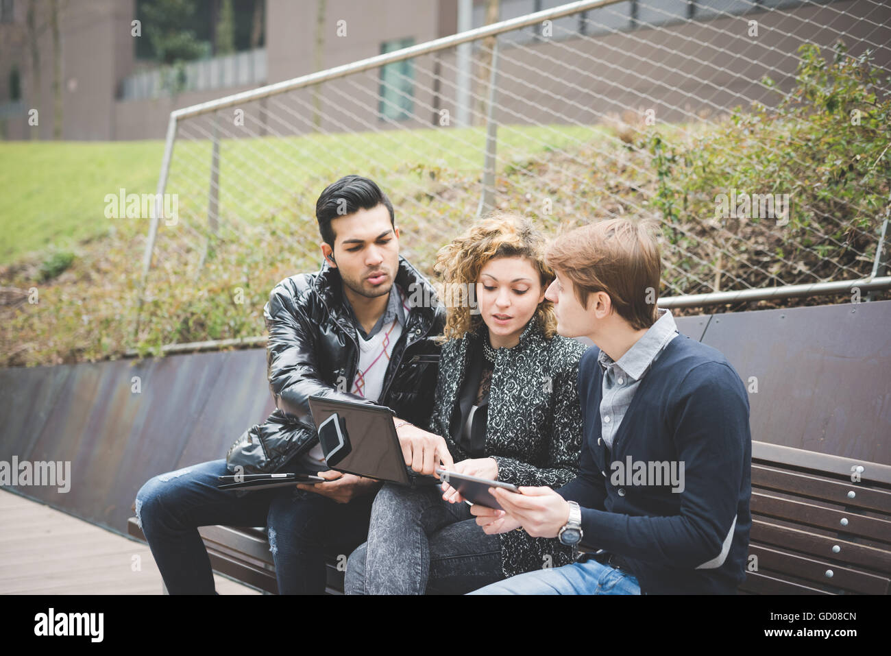 Multiracial business people working outdoor in town connected with ...
