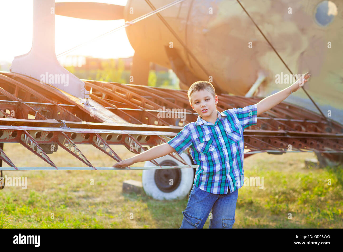 Little boy pilot near the vintage airplane at the airport Stock Photo ...