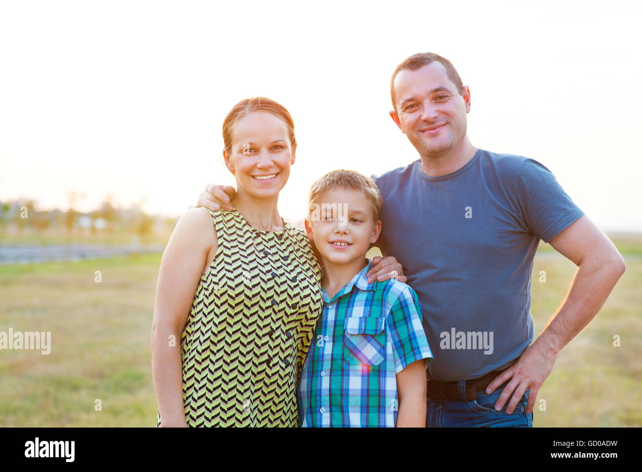 Happy young family with little son outdoors. Outdoors portrait Stock ...