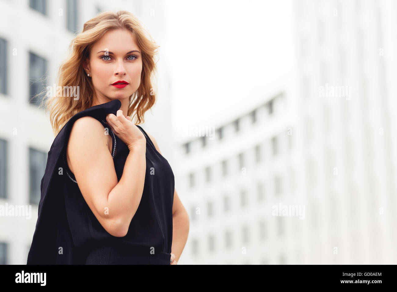 Closeup portrait of beautiful intelligent woman with blonde wavy hair ...